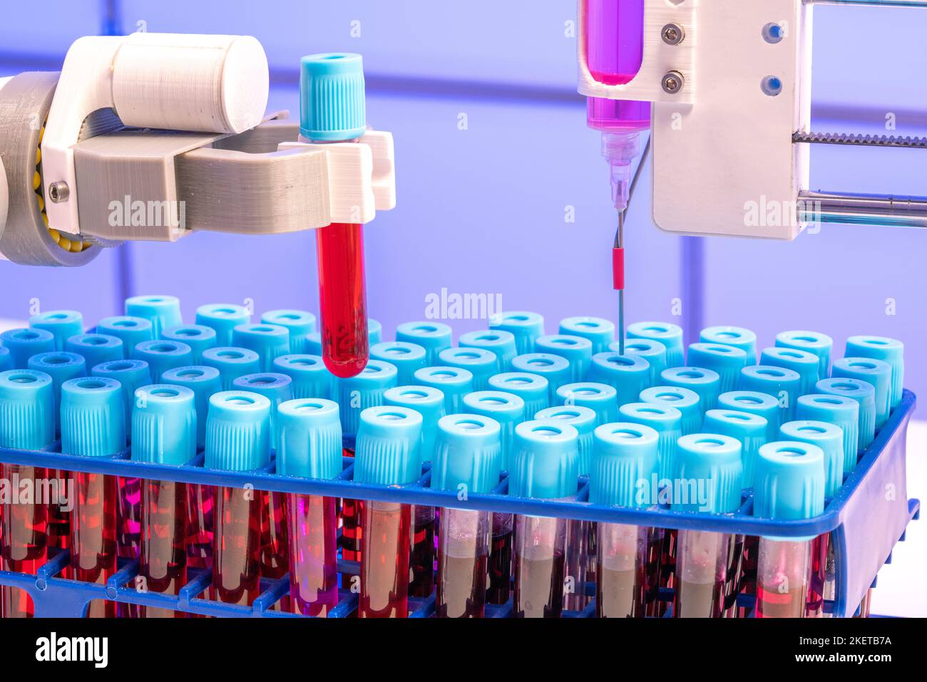 modern genetic laboratory PCR processor and robot with test tube in ...
