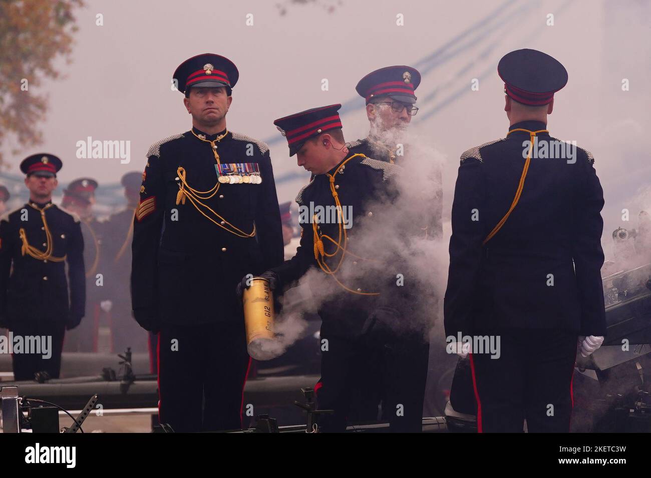 A member of the Honourable Artillery Company holds a smoking cartridge ...