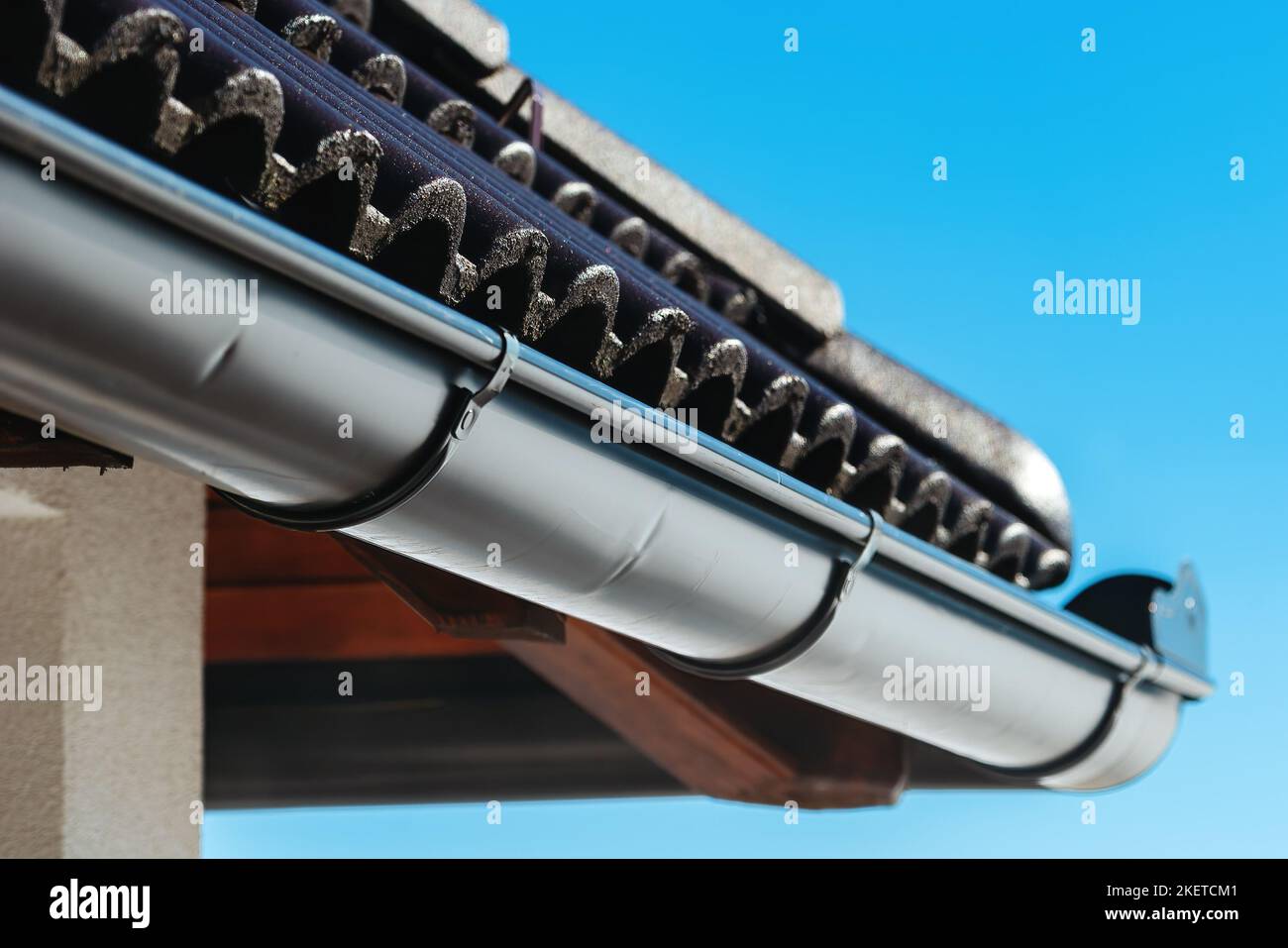 House roof rain gutter on sunny day, selective focus Stock Photo - Alamy