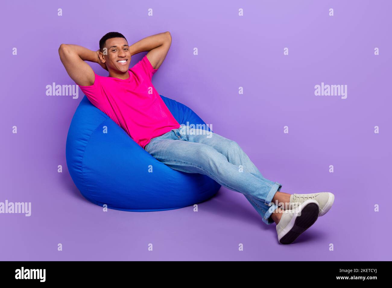 Full length photo of virile muscular man sit comfort chair hold arms ...