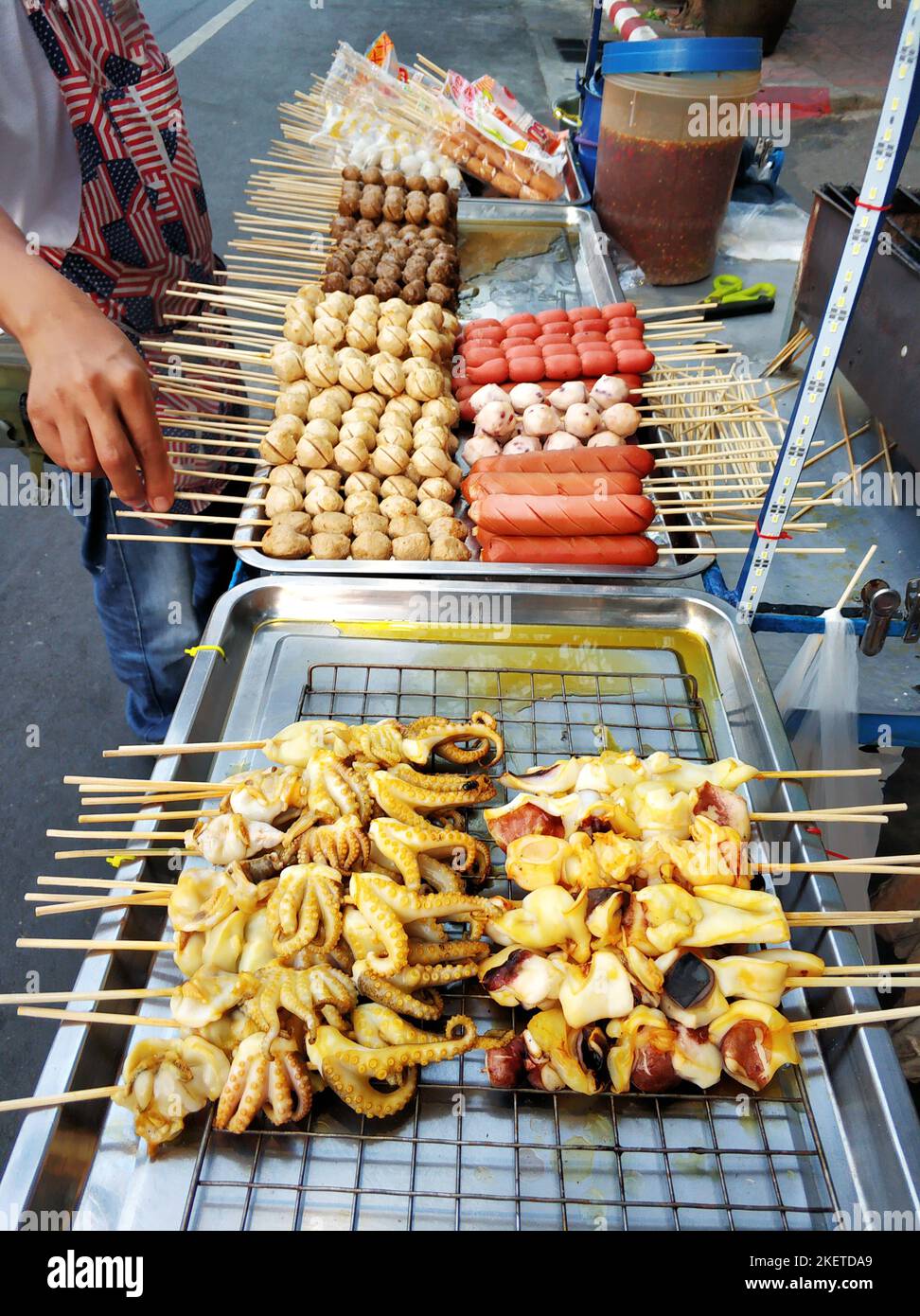 Snack and fried chicken stall at a market in Asia Stock Photo - Alamy