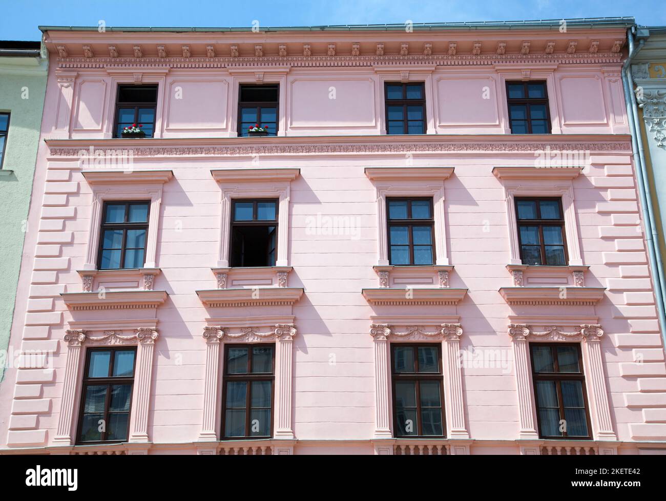 The facade of a pink historic building in Olomouc old town (Czech ...