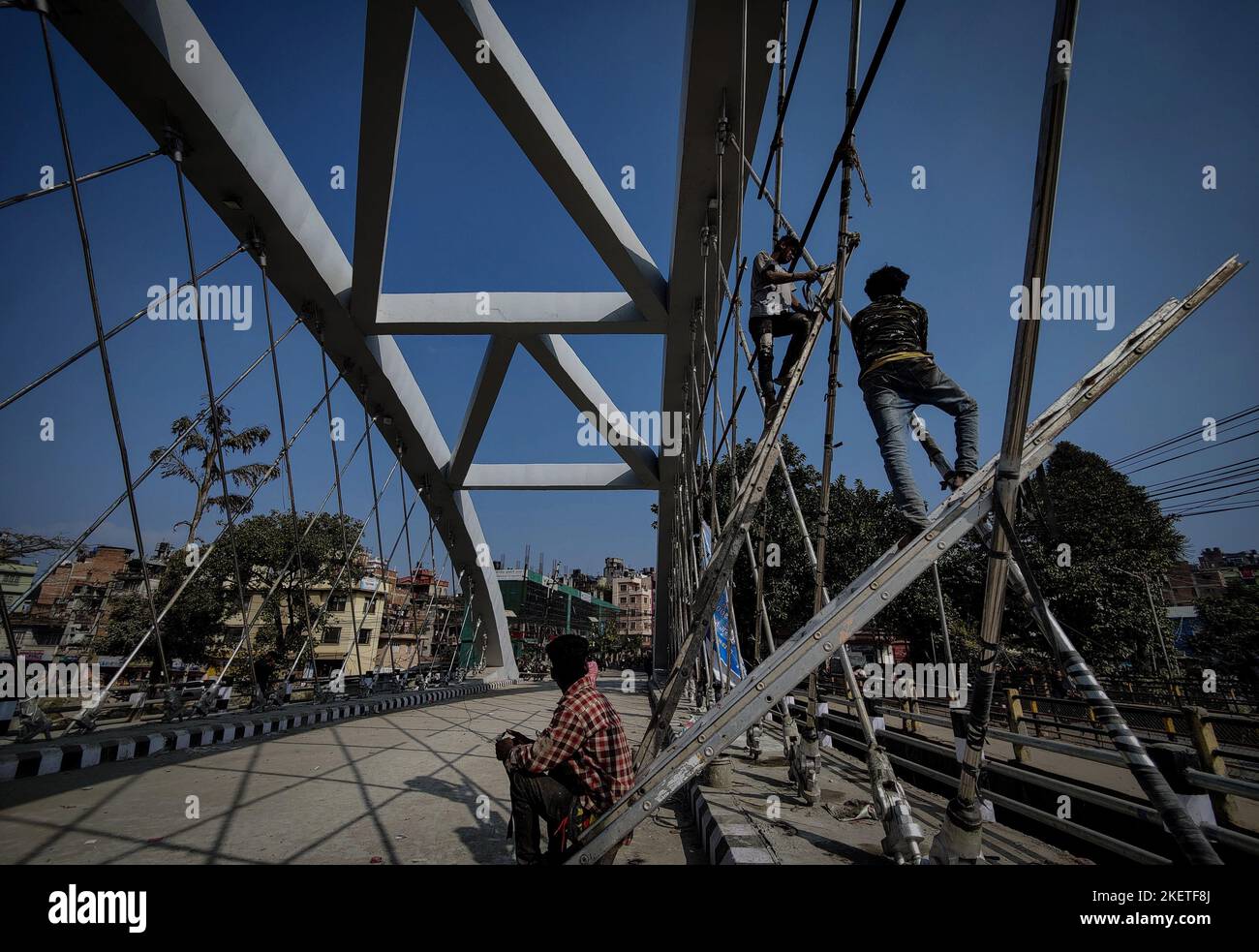 Kathmandu, Bagmati, Nepal. 14th Nov, 2022. People work at the construction site of arc bridge in ...