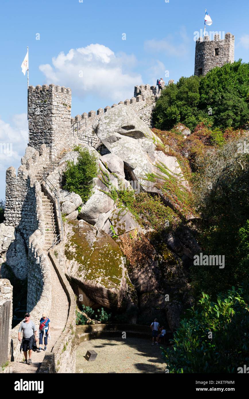 Tourists climb the fortified walls and turrets of the 10th century ...