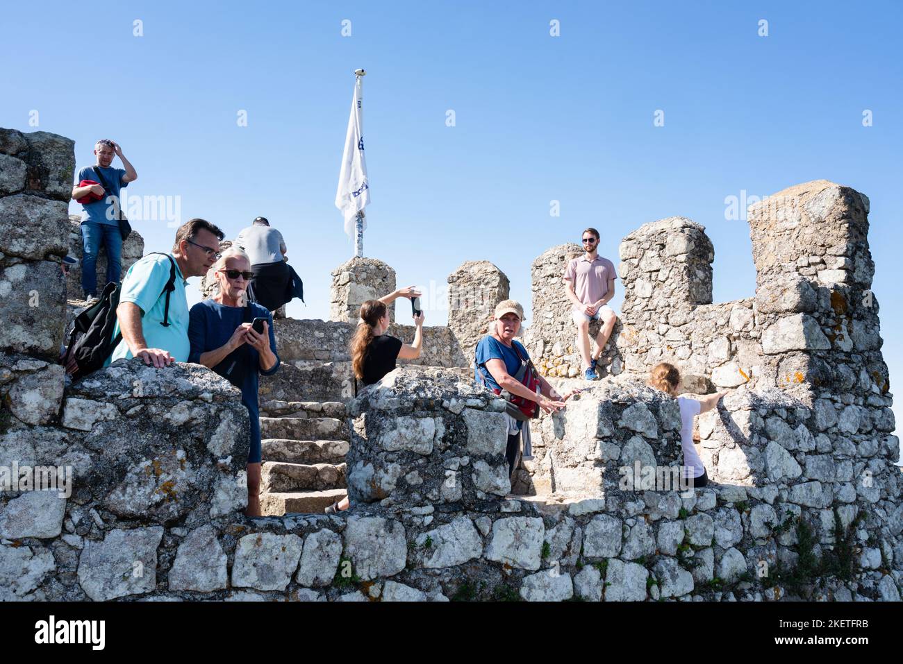 Tourists climb the fortified walls and turrets of the 10th century ...