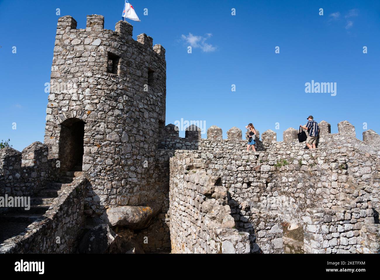 Tourists climb the fortified walls and turrets of the 10th century ...