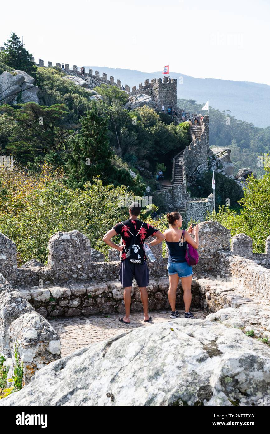 Tourists climb the fortified walls and turrets of the 10th century ...