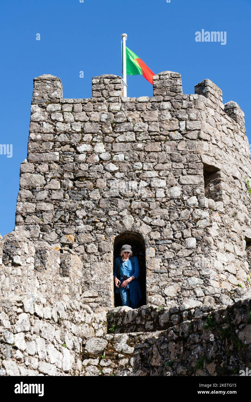 Tourists climb the fortified walls and turrets of the 10th century ...