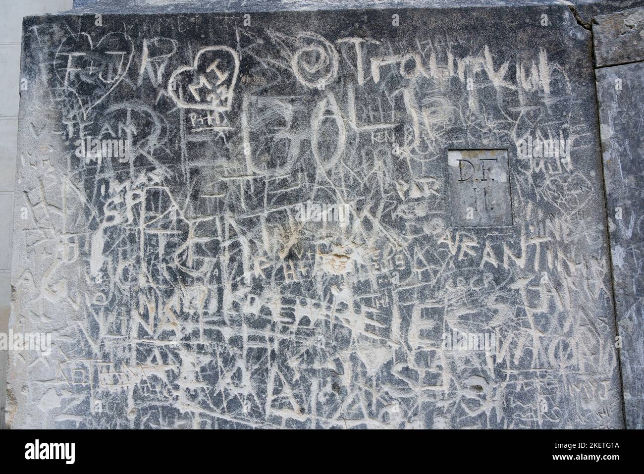 Years and years of overwritten names graffiti written scratched on a ...