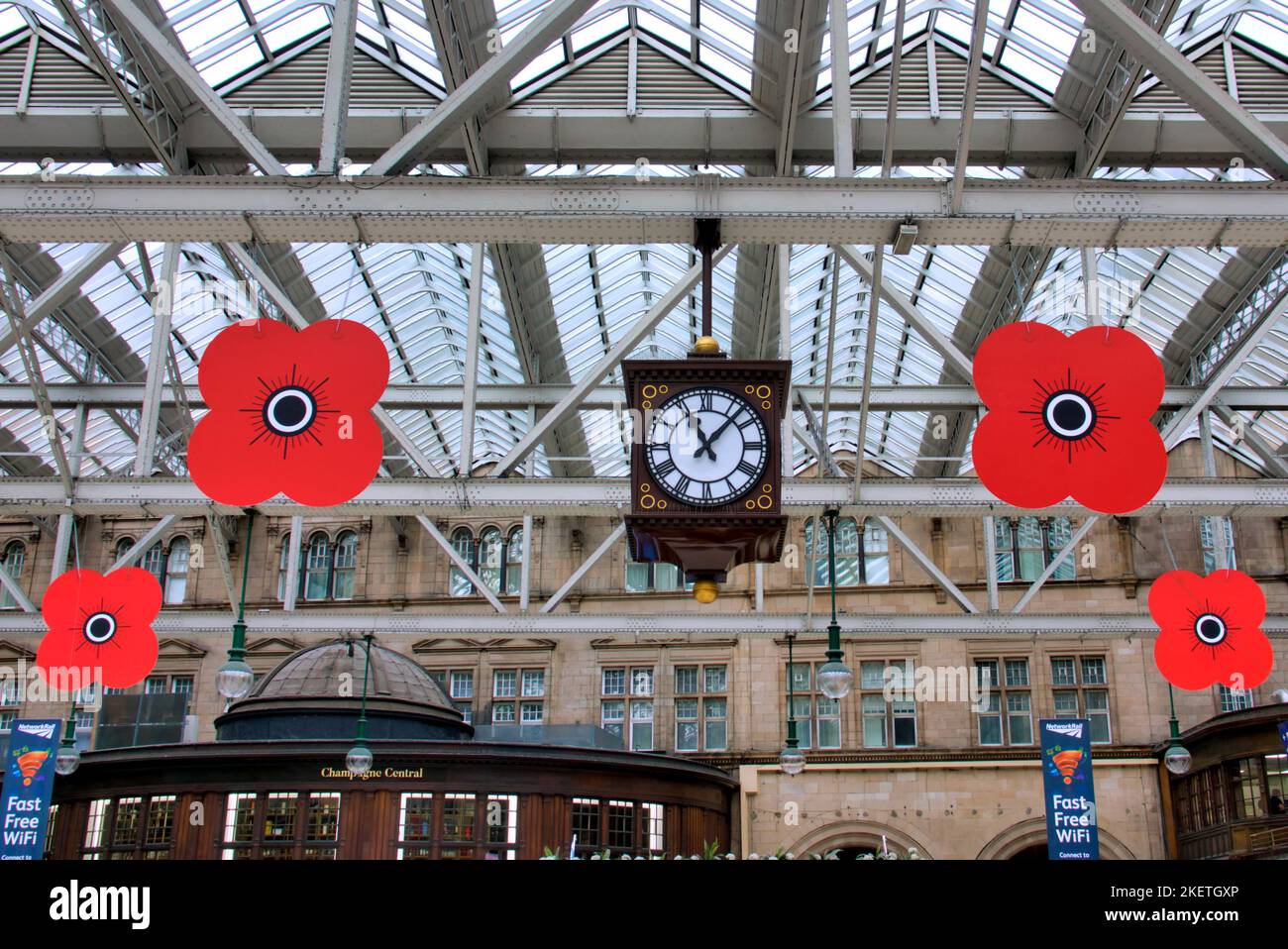 giant red poppies suspended from the roof of central railway station ...