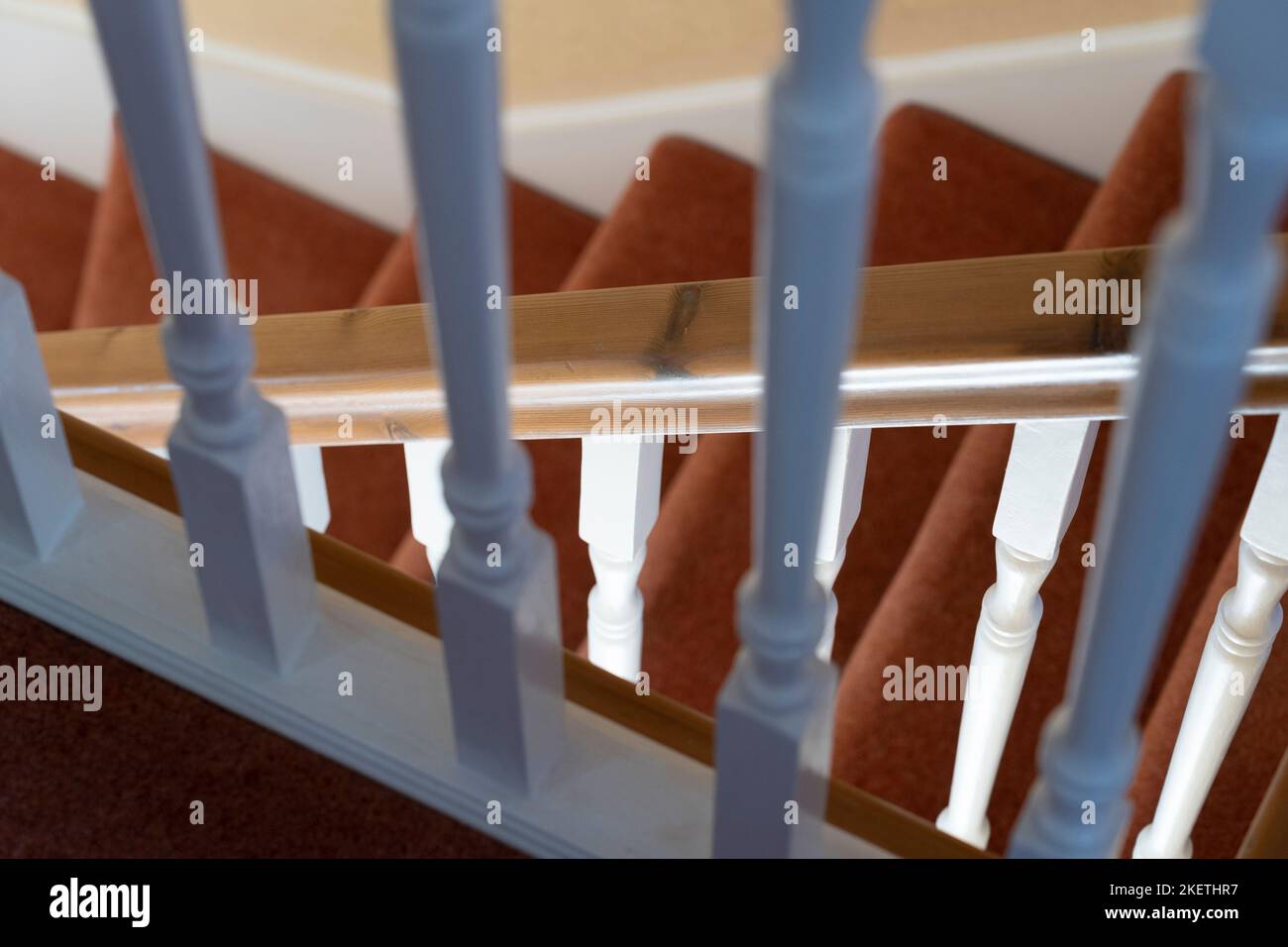 Interesting and unusual perspective looking through landing banisters ...