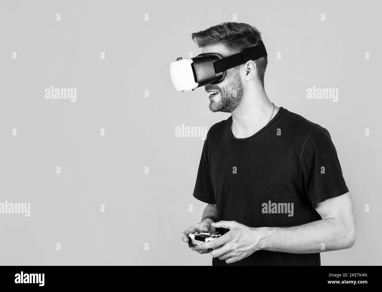 young guy with unshaven face and stylish hair wear wireless vr headset ...