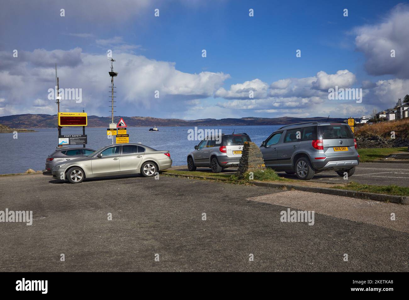 Cars waiting at the ferry port of Tarbert to Portavadie. The Erin Julia ...