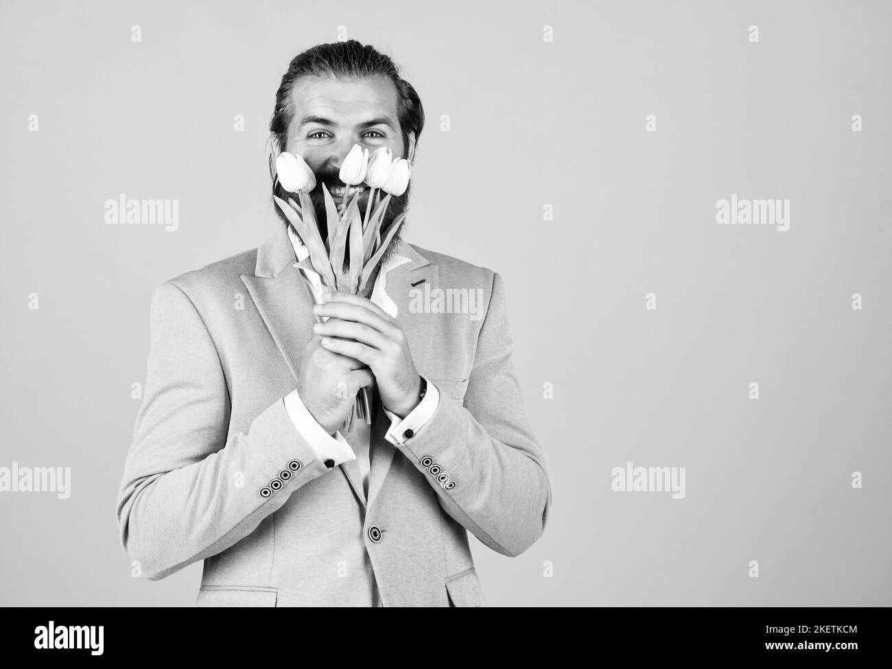 man holding bouquet of tulips. happy valentines day. man share tulip ...
