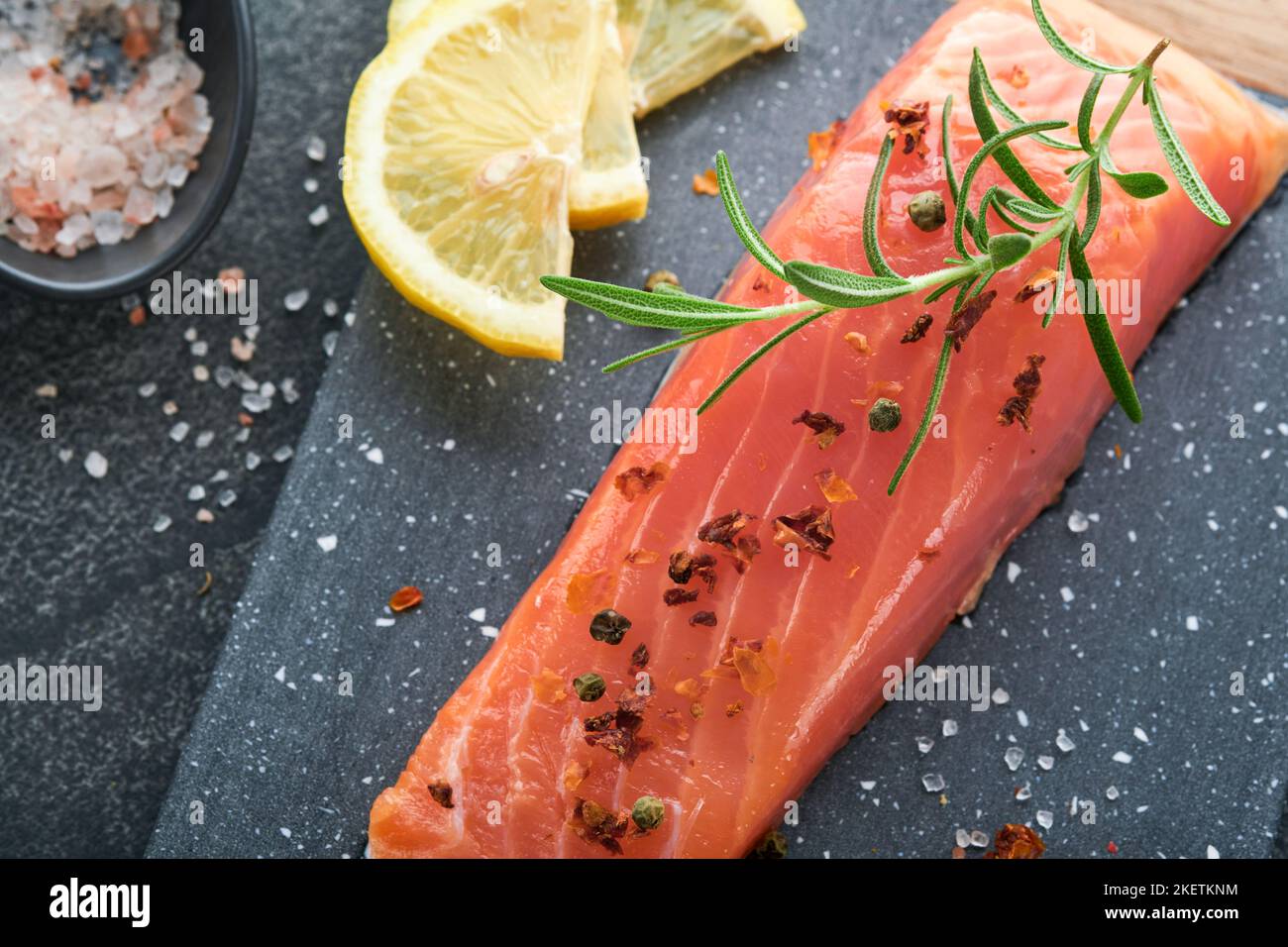 Salmon fish piece. Fresh raw salmon fish piece on marble board stand ...