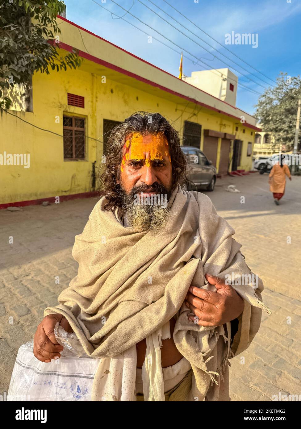 Pushkar, Rajasthan, India - November 2022: Portrait of an old sadhu baba on the street of ...