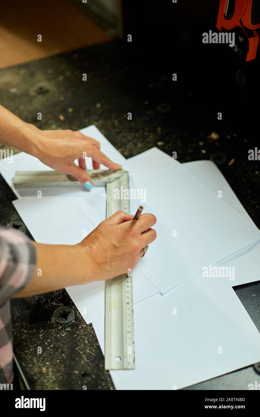 Female interior designer working on drawings, woman architect draws ...