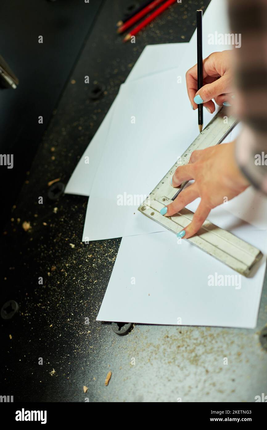 Female interior designer working on drawings, woman architect draws ...