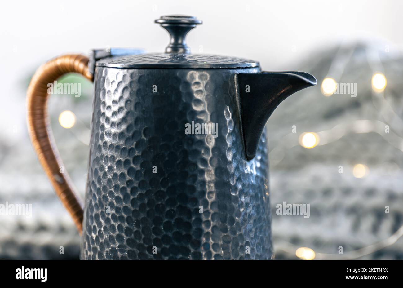 Beautiful textured teapot on a blurred background close-up Stock Photo ...