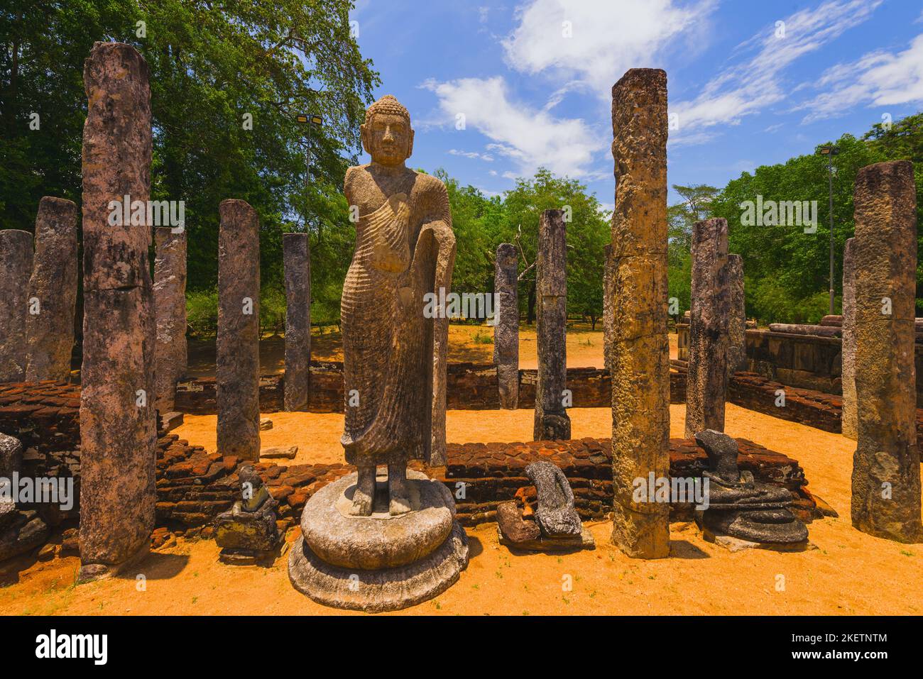 Pillars and standing Buddha in Polonnaruwa Sacred Quadrangle Stock ...