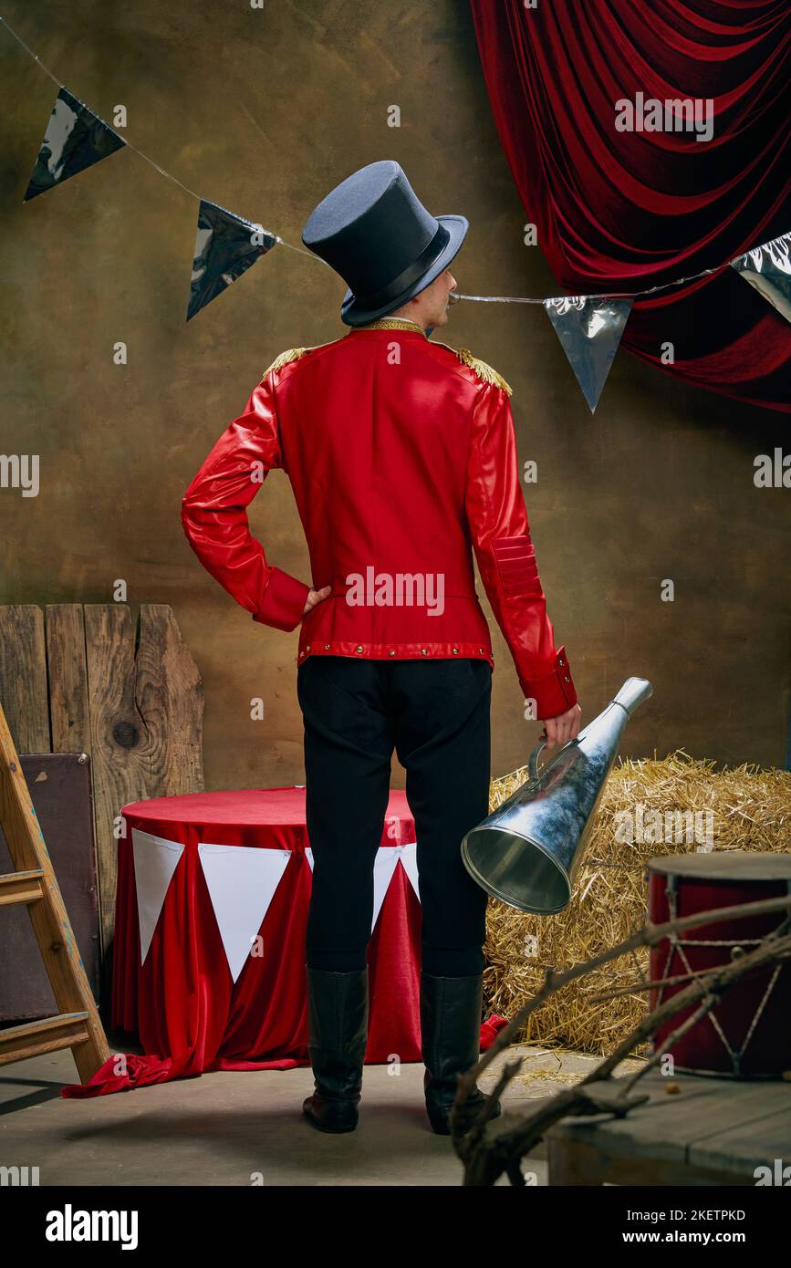 Back view. Illusionist or showman. Young man retro circus entertainer ...