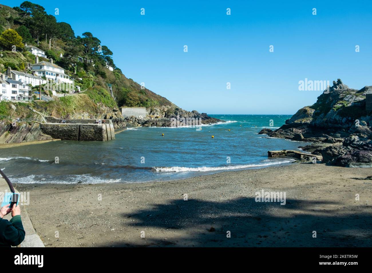 20th September 2019 - Polperro, UK: A few visitors enjoy autumn ...