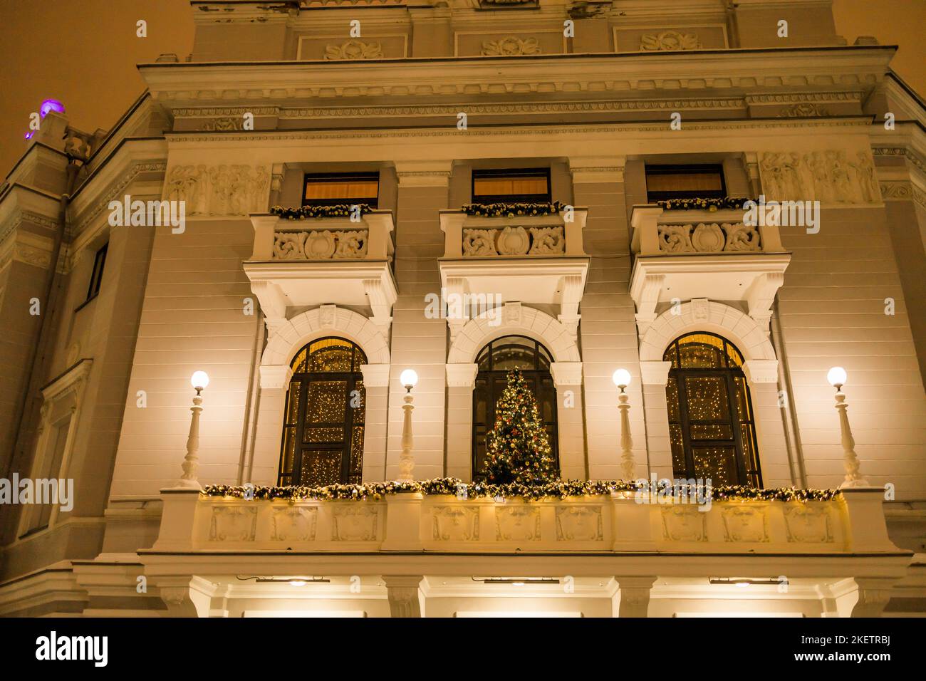 Christmas tree decorated with lights illuminating and balls bauble and ...