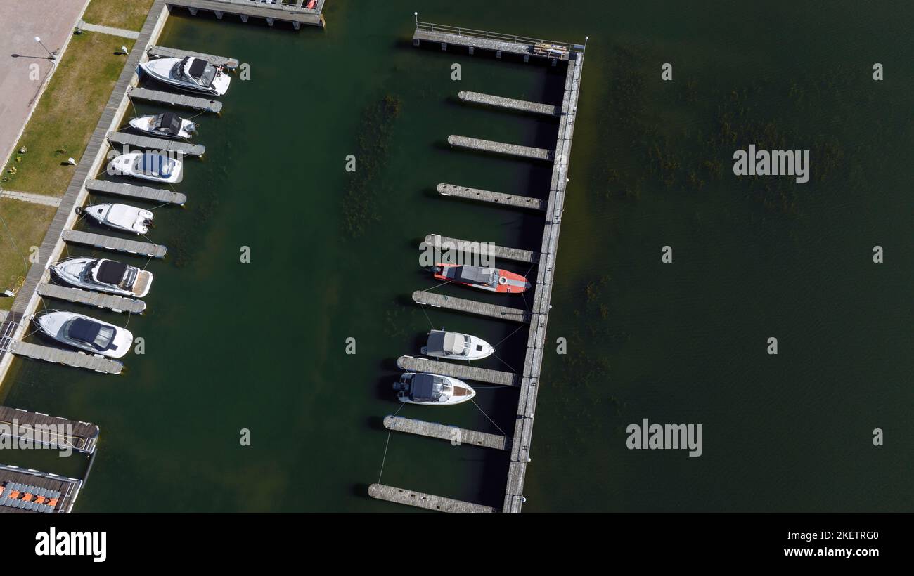 Aerial view of a marina with moored boats over green river bay Stock ...
