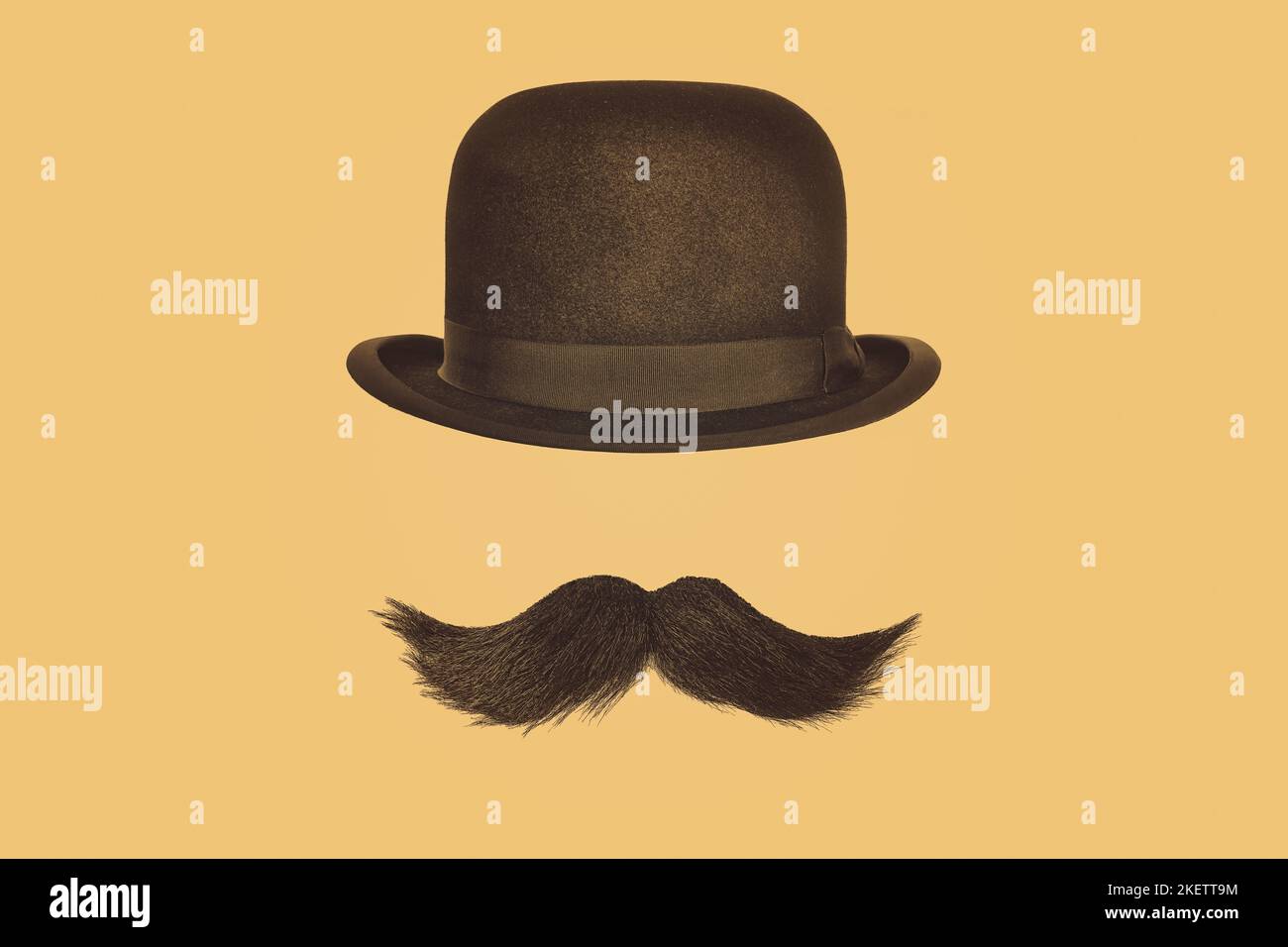 Vintage bowler hat with black curly moustache on a sepia brown ...