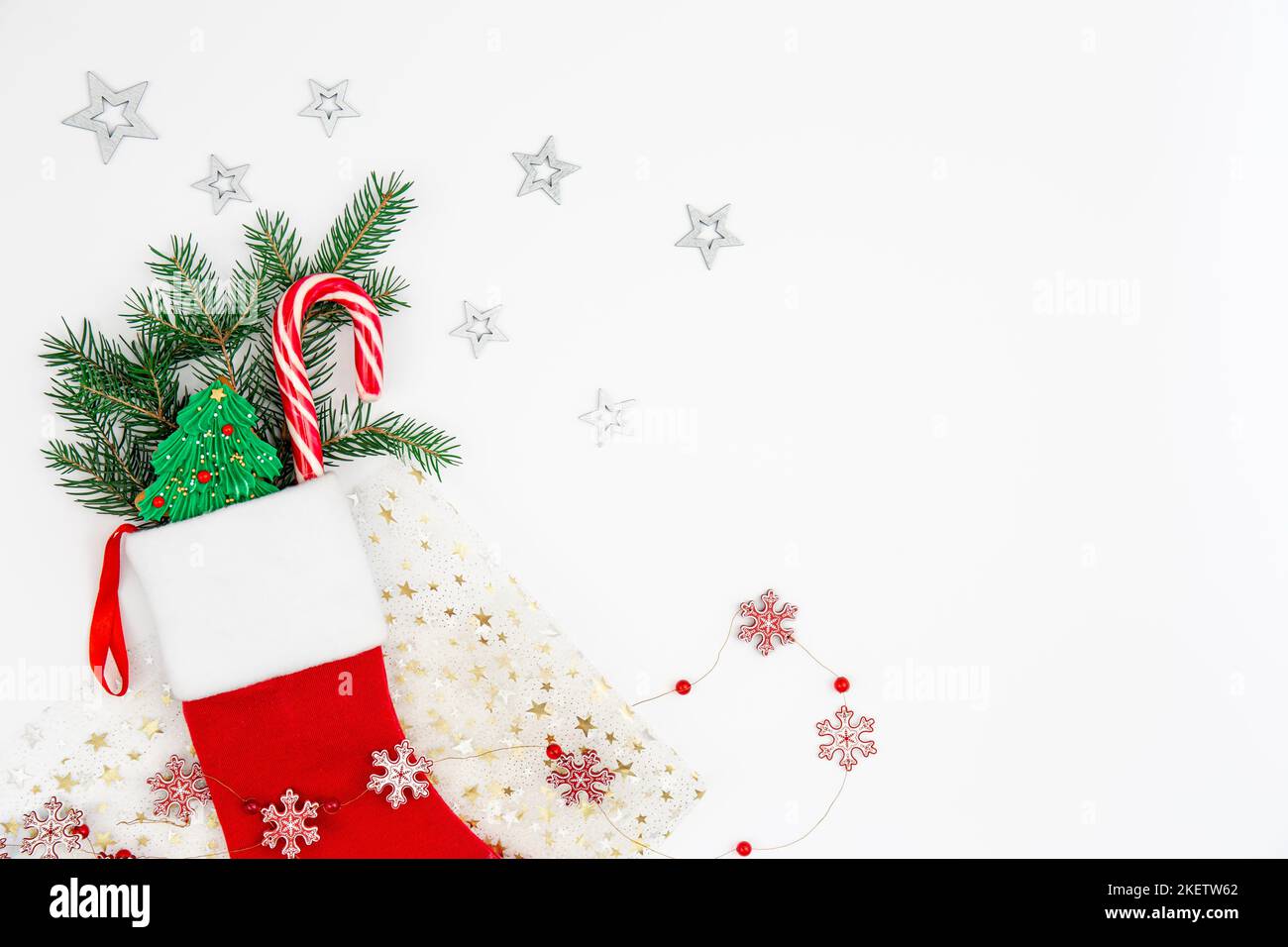 Christmas sock with decorative details on white background, copy space ...