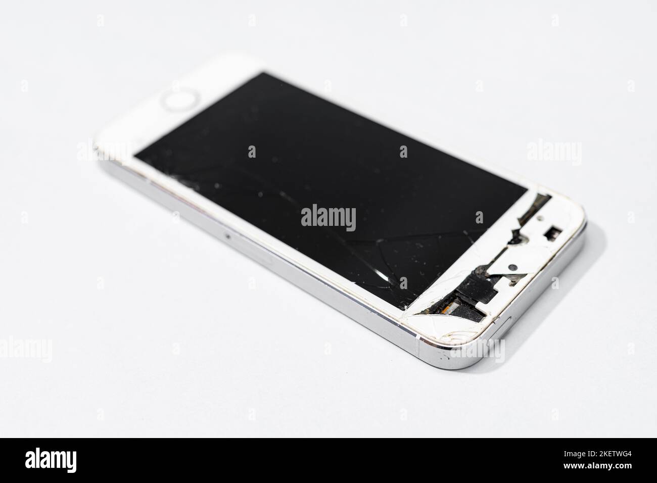 Smartphone with broken screen isolated on gray background. Damaged ...