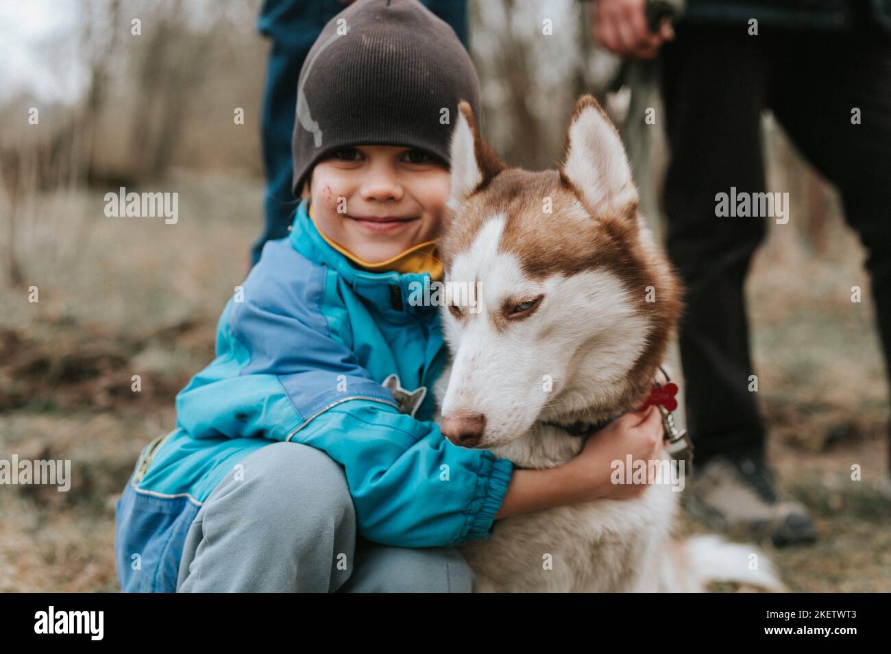 kid and his friend husky siberian dog. portrait little child boy ...