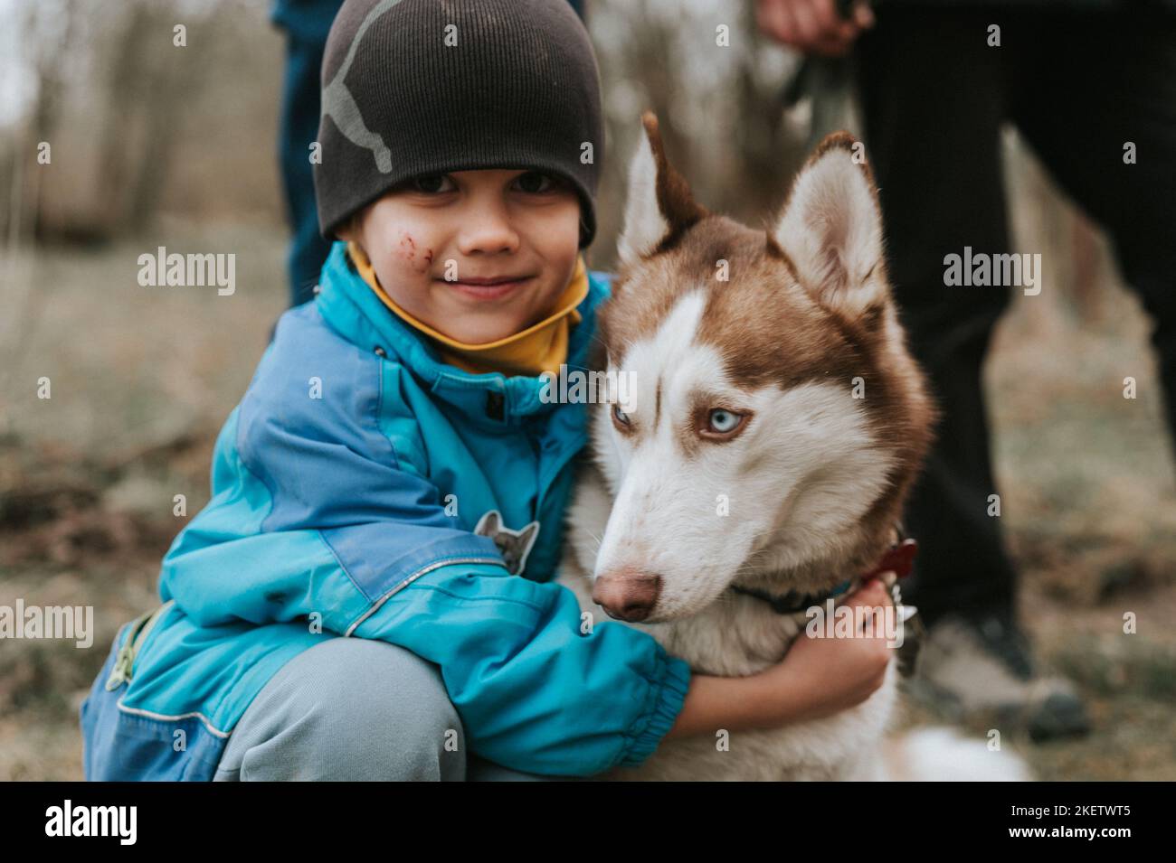 kid and his friend husky siberian dog. portrait little child boy ...