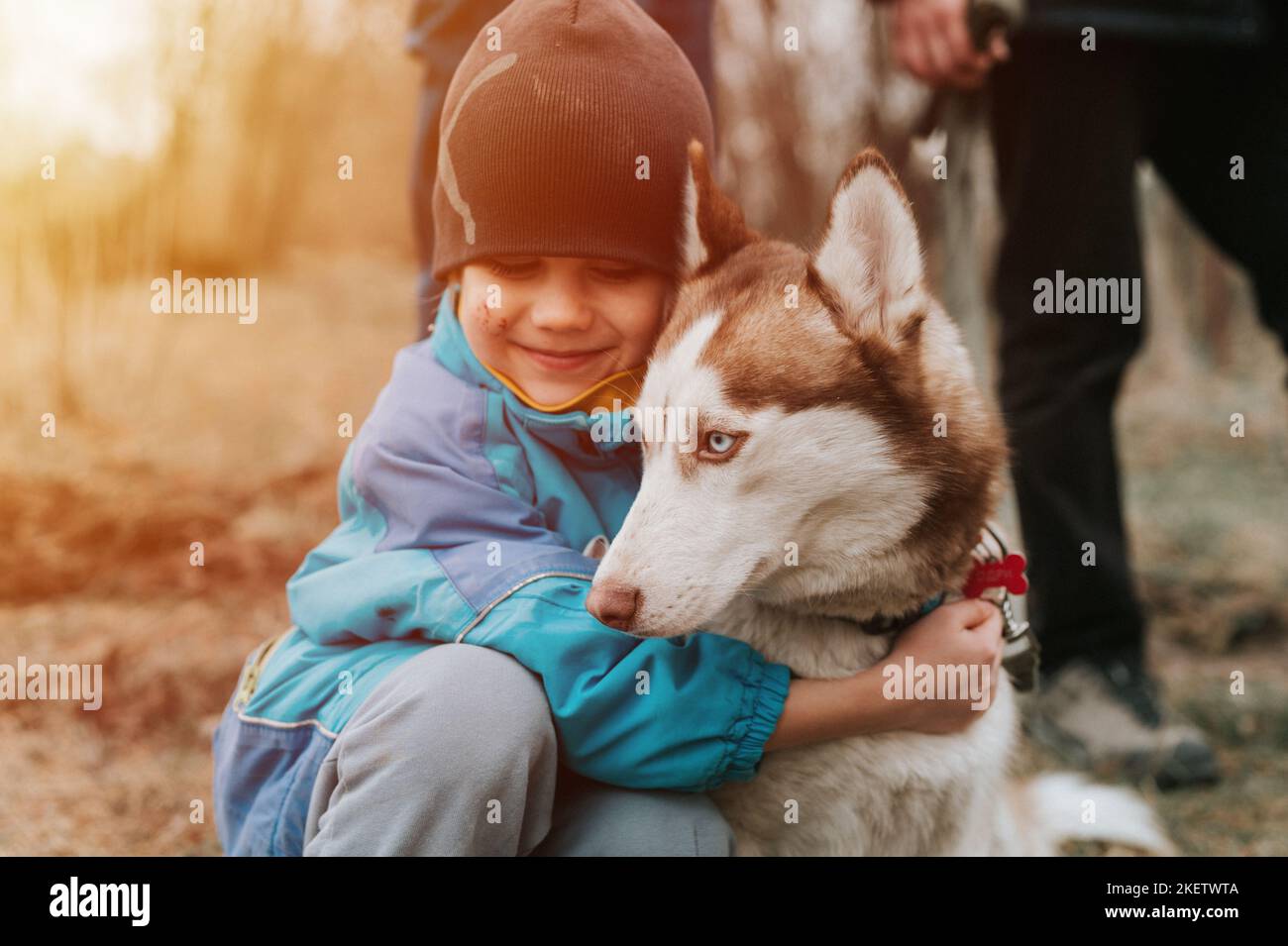 kid and his friend husky siberian dog. portrait little child boy ...