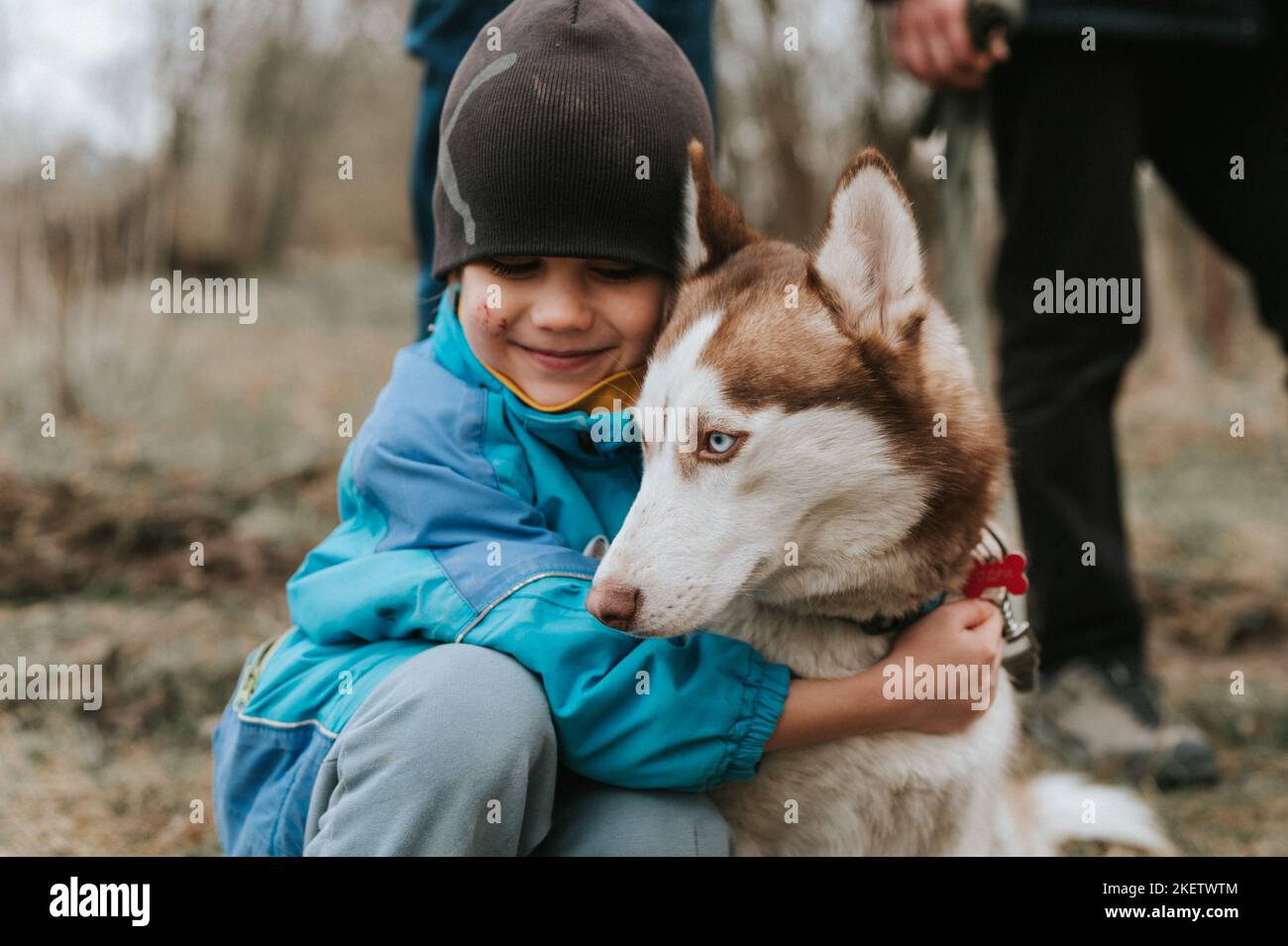 kid and his friend husky siberian dog. portrait little child boy ...