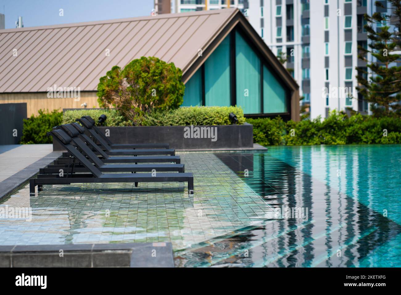 Recreation area with swimming pool in a modern condominium residential ...