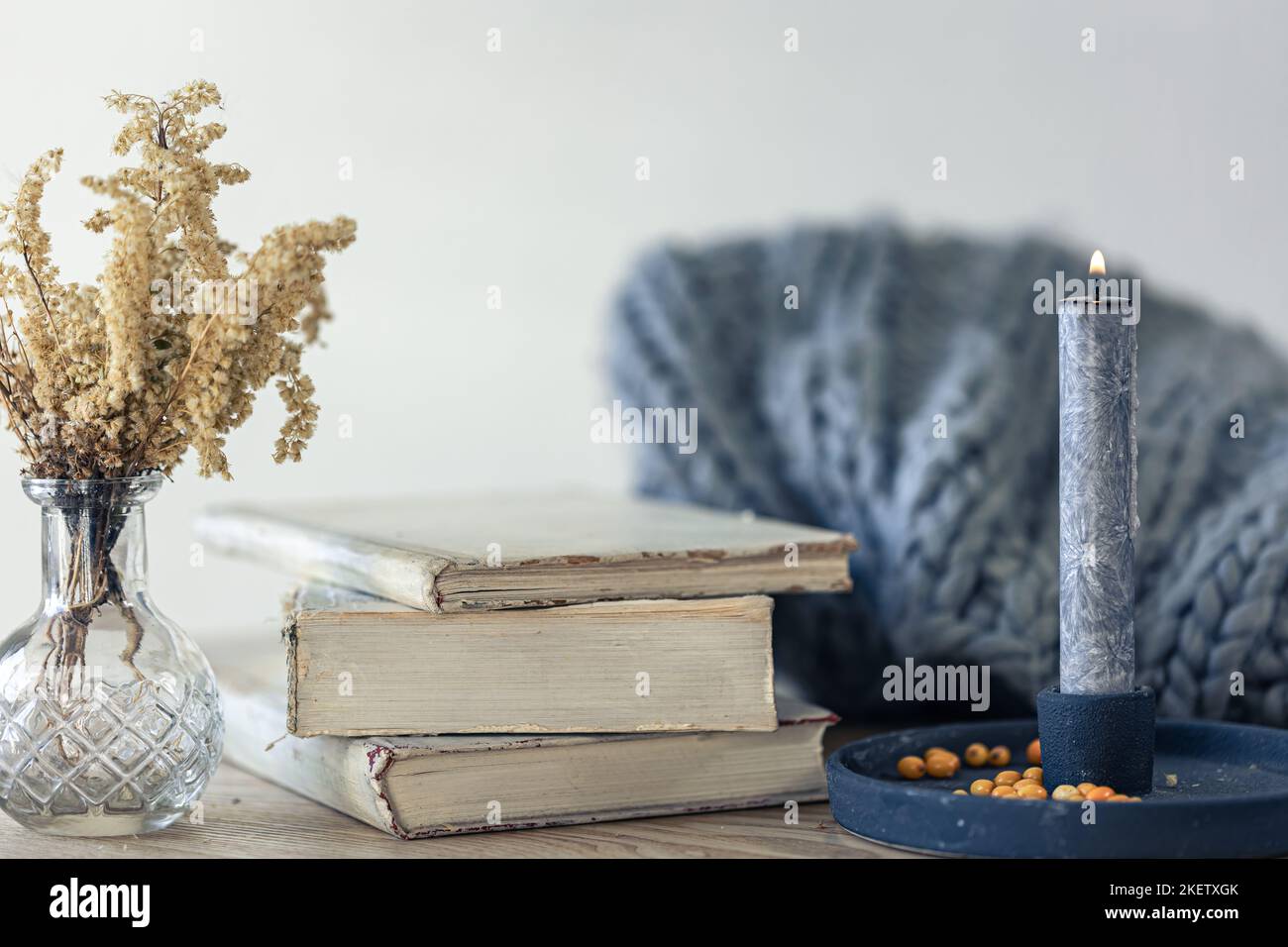 Cozy home composition with books on the table close-up Stock Photo - Alamy