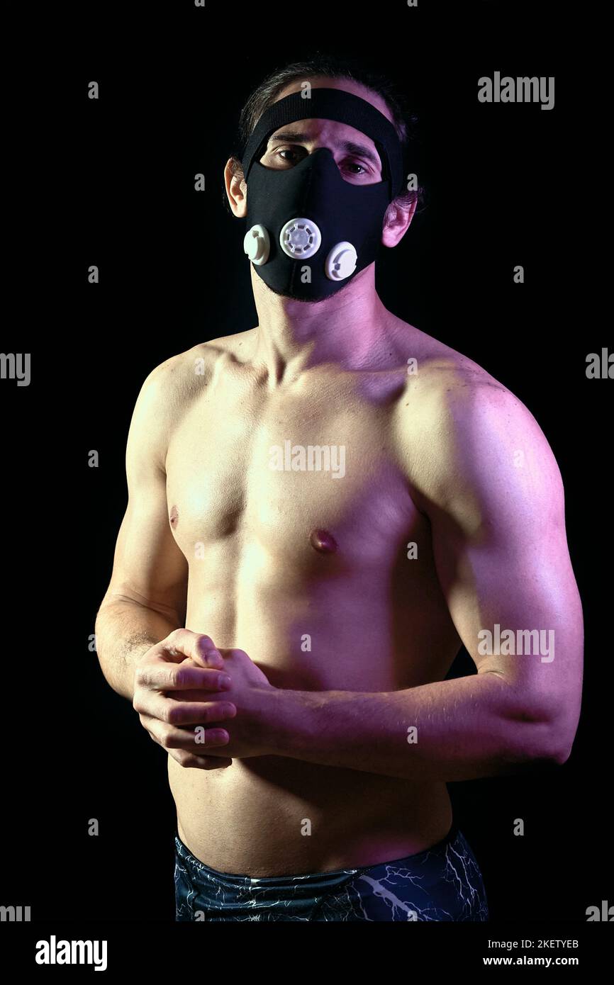 Fit young man training alone despite coronavirus pandemic using a ...