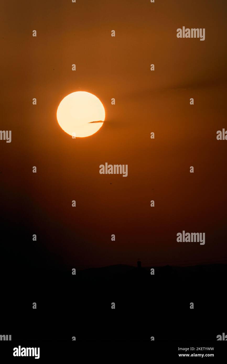orange sunset with the big round sun a clear day, albufera natural park ...