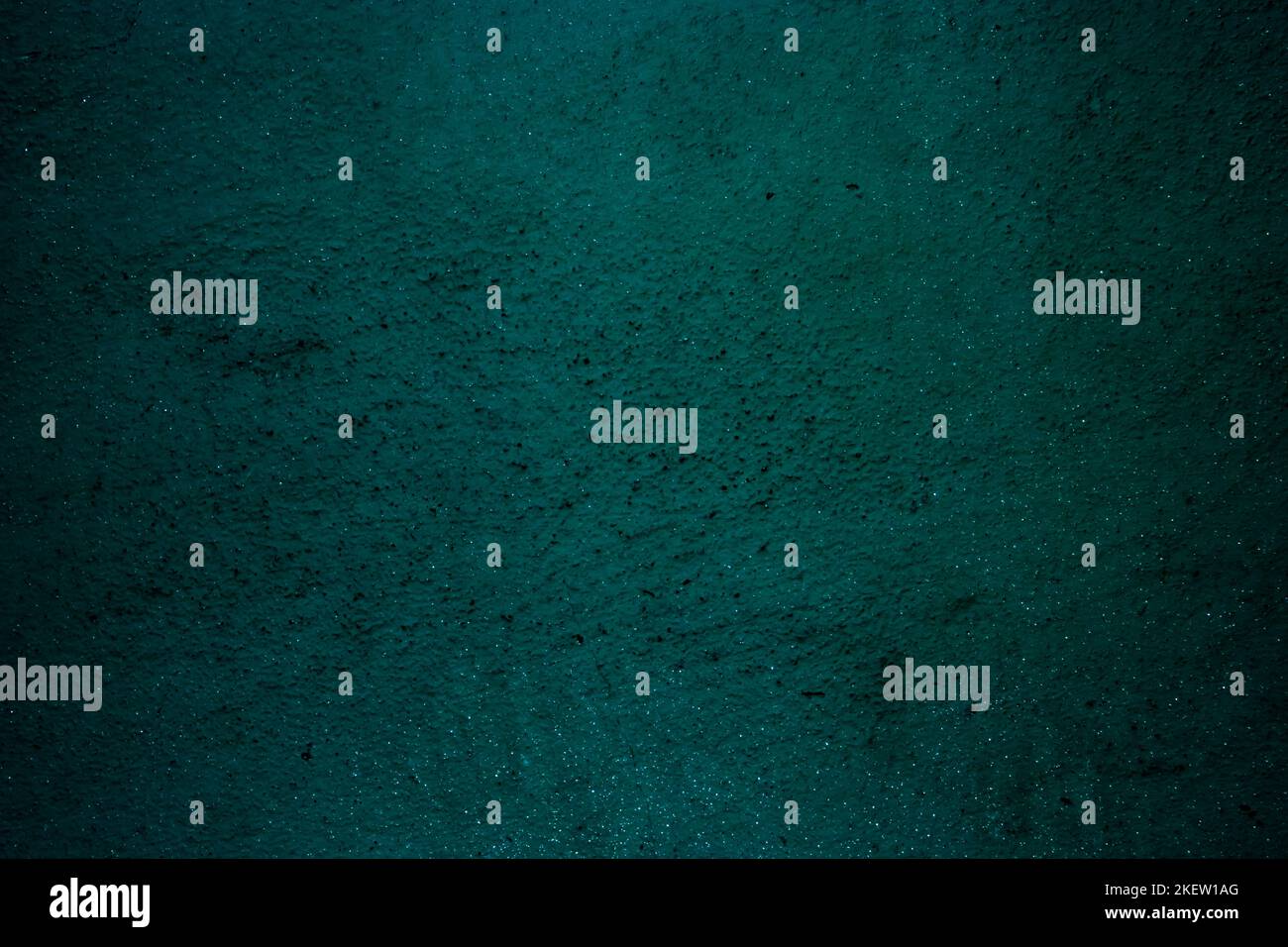 Teal colored abstract wall background with textures of different shades ...