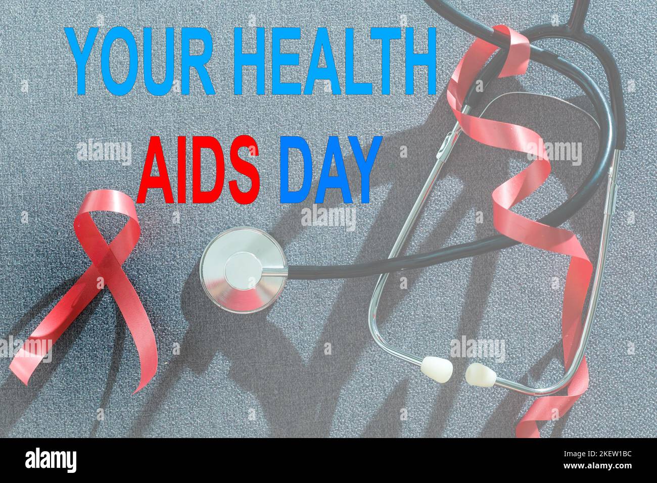red ribbon. AIDS awareness sign. World HIV Day symbol Stock Photo - Alamy