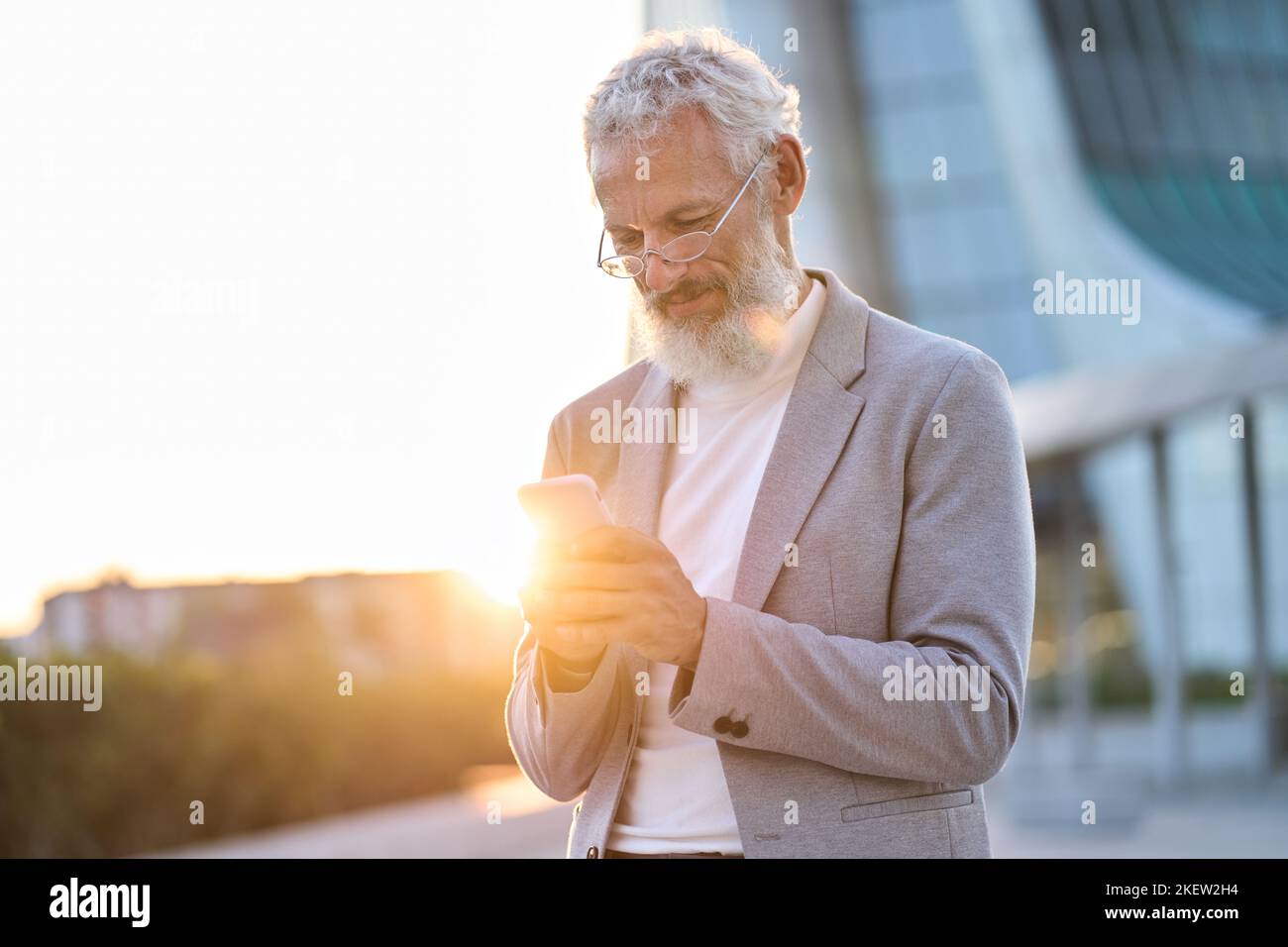 Happy man holding phone hi-res stock photography and images - Alamy
