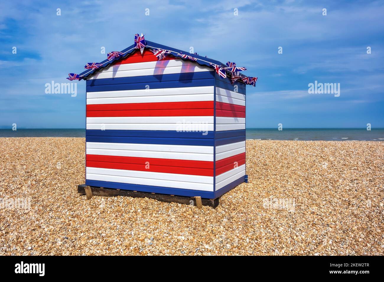 Red white and Blue colourful beach hut with flag decorations on the ...