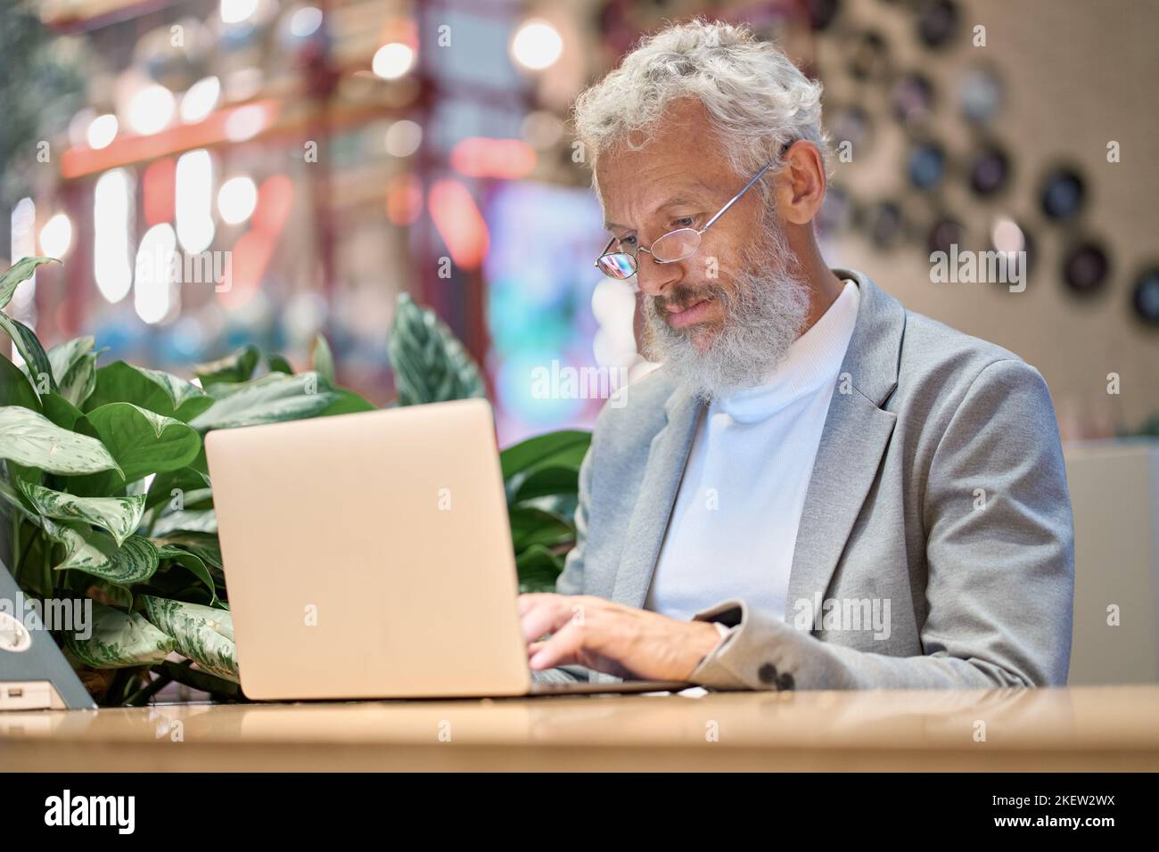 Busy older senior business man using laptop working late on computer Stock Photo - Alamy