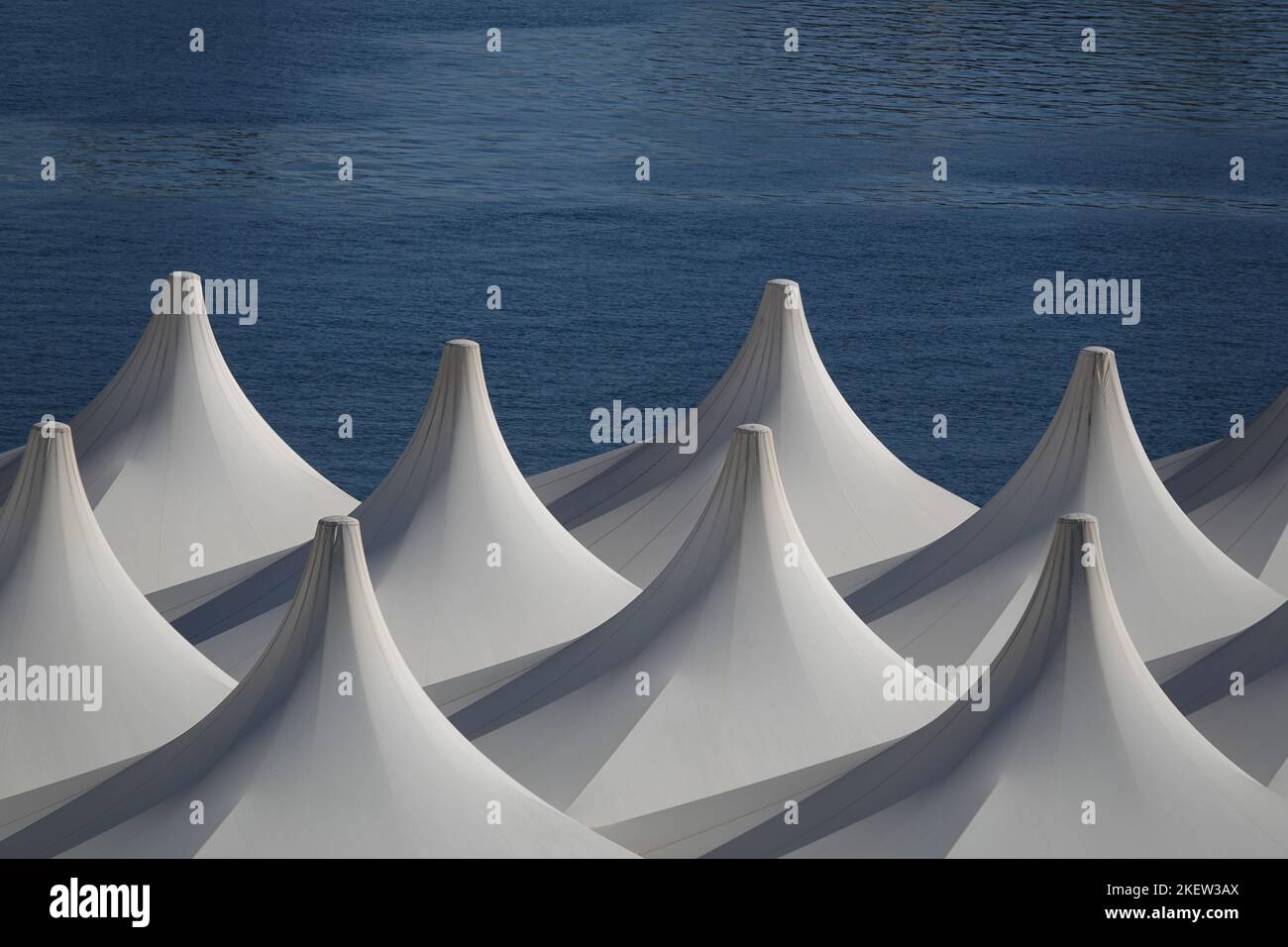 Abstract pattern created by the white rooftop of a temporary pavilion ...