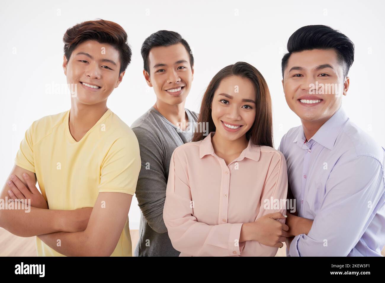 Group of young Vietnamese people smiling and looing at camera, isolated ...