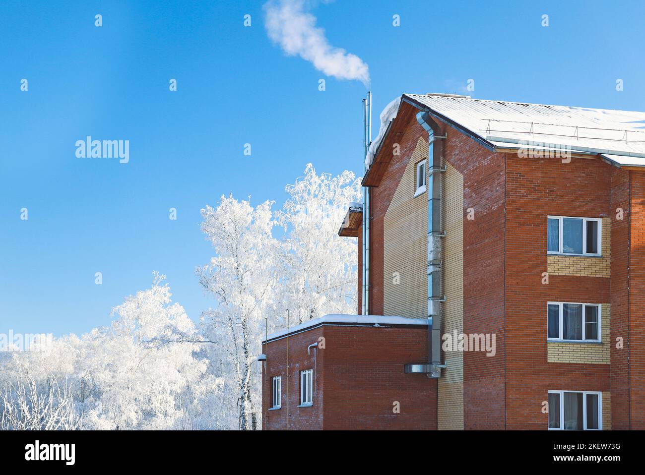 Smoke from the chimney of a private house with its own boiler room ...
