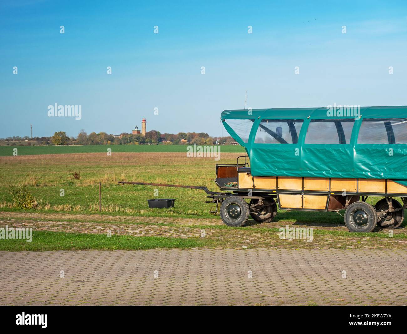 Car for tourists and lighthouse tour. Landscape with Cape Arkona ...