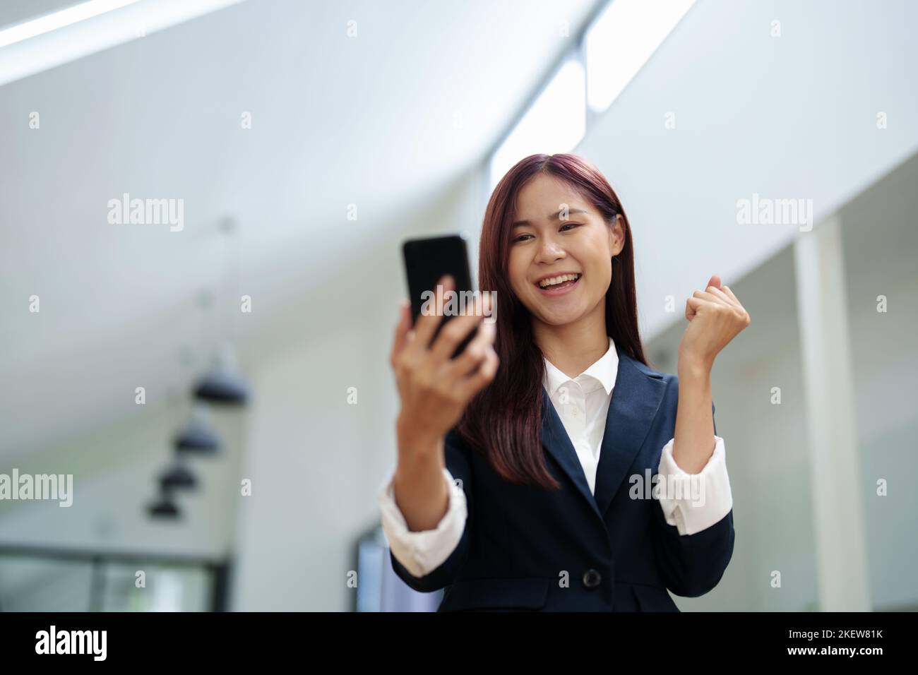 Businessmen use the smart phone to contact partners, success concept ...
