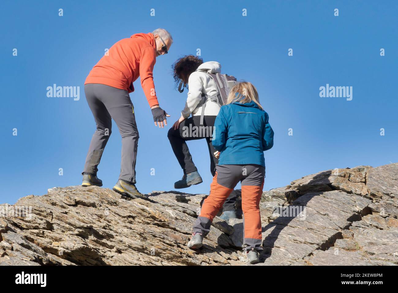 Teamwork couple hiking help other hi-res stock photography and images ...